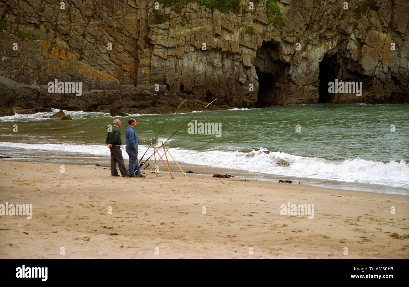 Fishing on the beach at Skrinkle Haven in Pembrokeshire Wales Stock ...