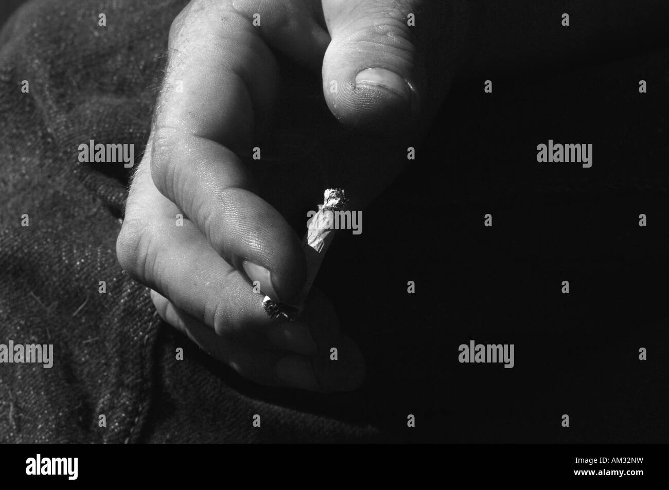 Smoking an unfiltered cigarette hi-res stock photography and images - Alamy