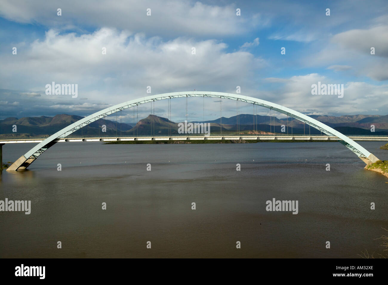 An arched bridge over Theodore Roosevelt Lake near the Roosevelt Dam at ...
