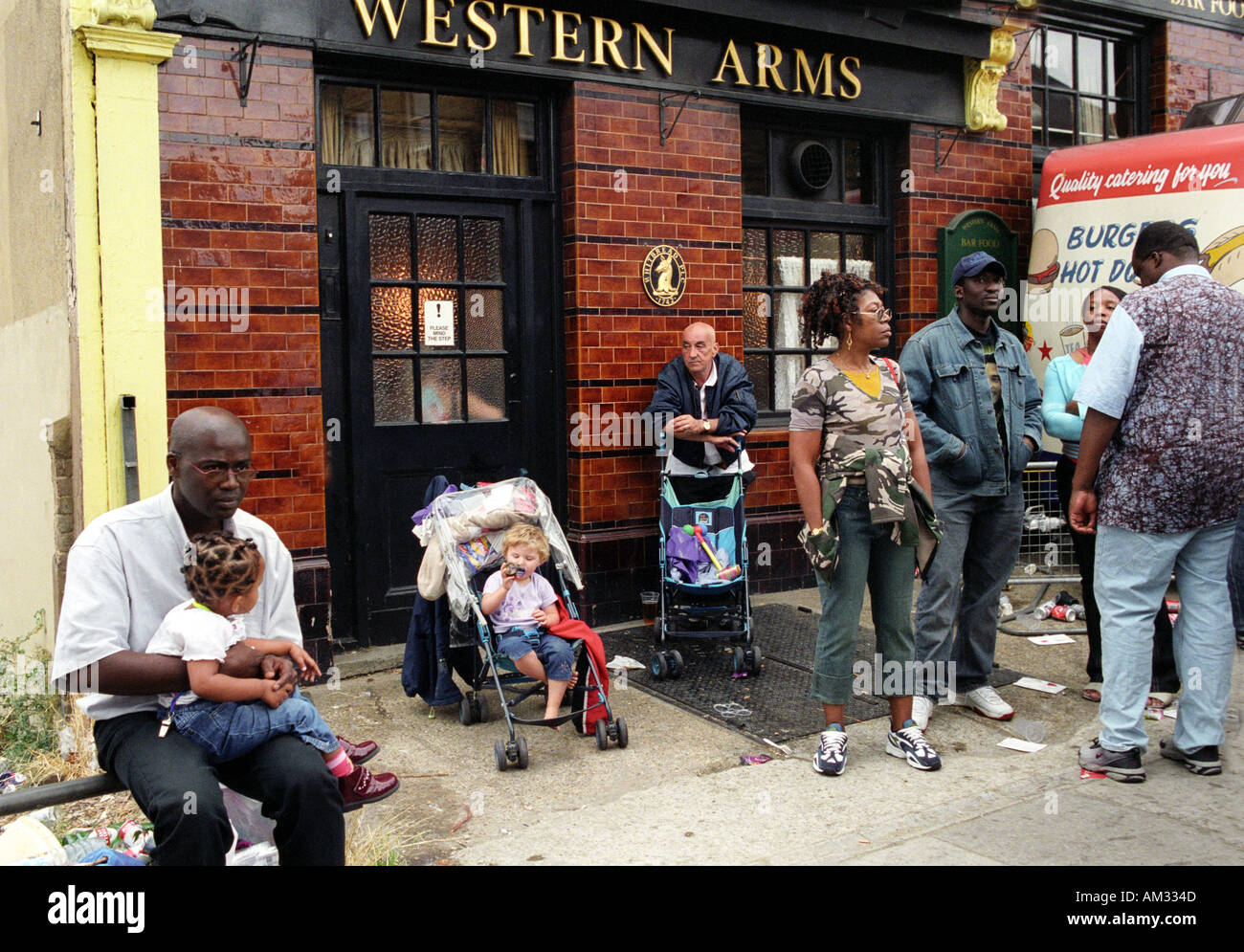 Group of people waiting outside for pub to open Stock Photo - Alamy