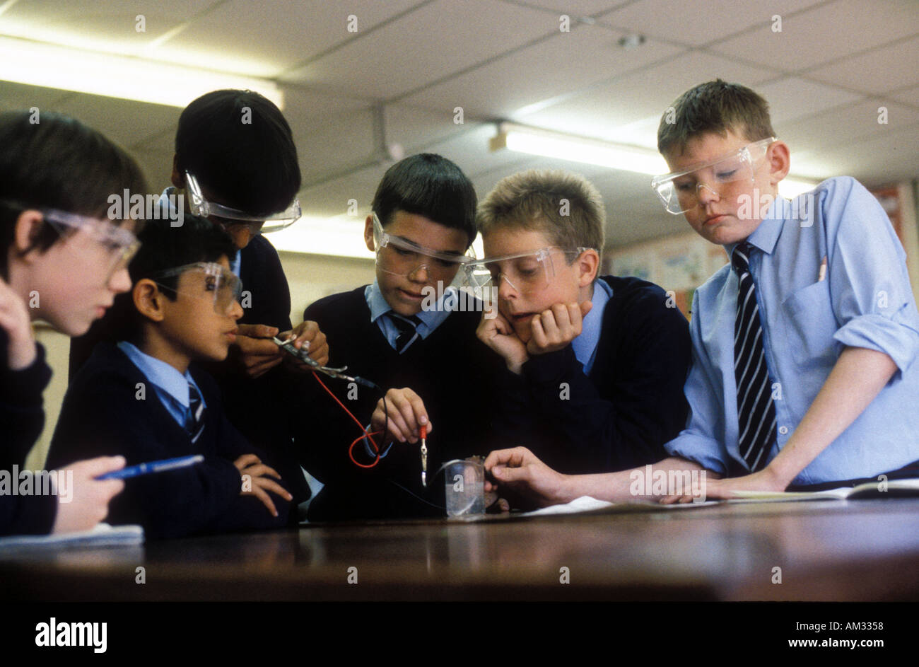 Secondary school pupils doing experiment in science laboratory Stock ...