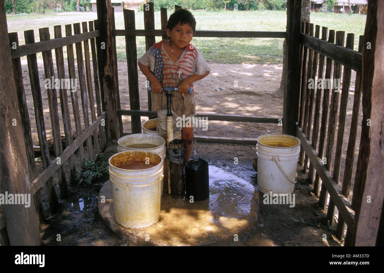 Child pumping water from well 40 metres underground at beni nr Trinidad ...