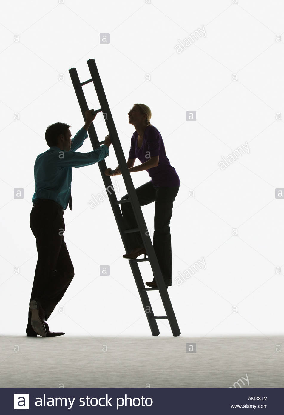 A Woman Climbing Up A Ladder Stock Photos & A Woman Climbing Up A ...