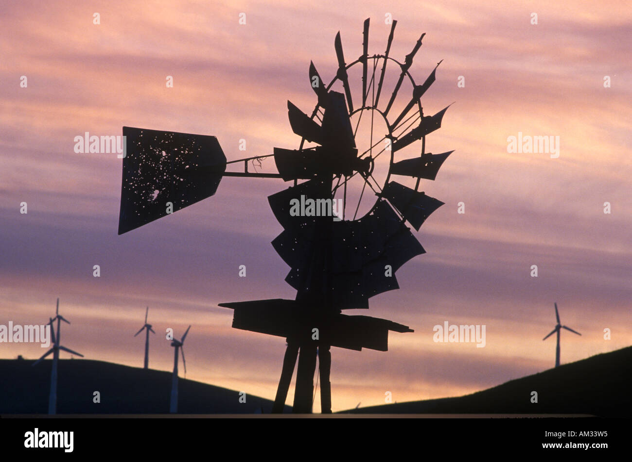 Windmill and wind turbines at sunset on Route 580 in Livermore CA Stock ...
