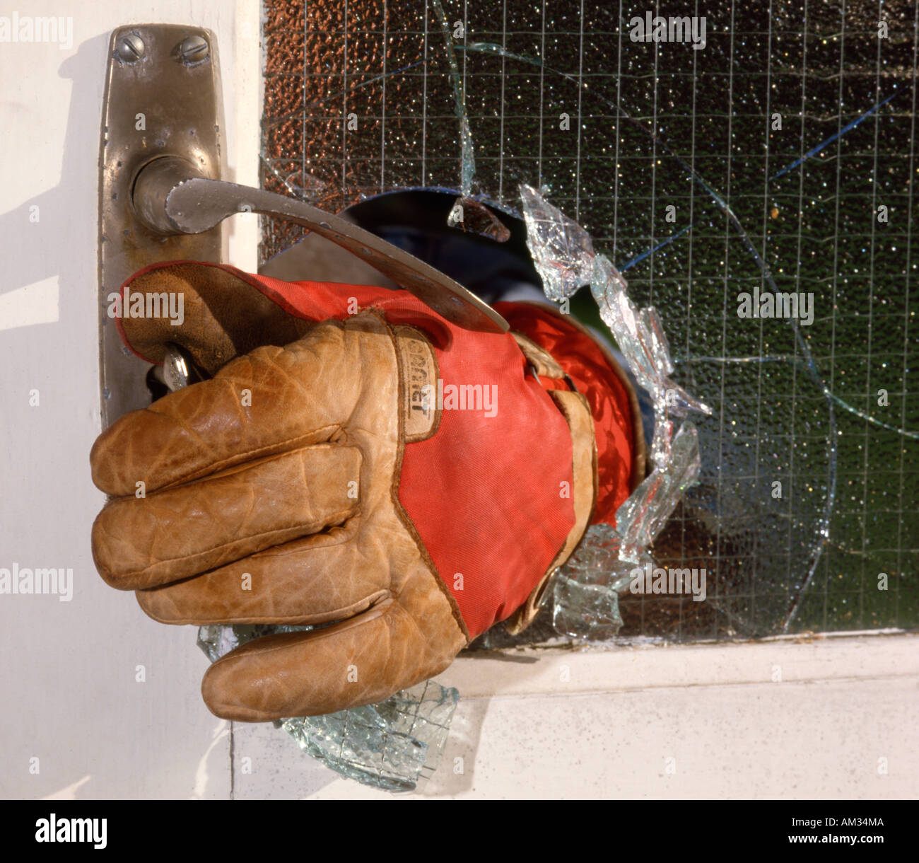 Burglar breaking into house Stock Photo - Alamy