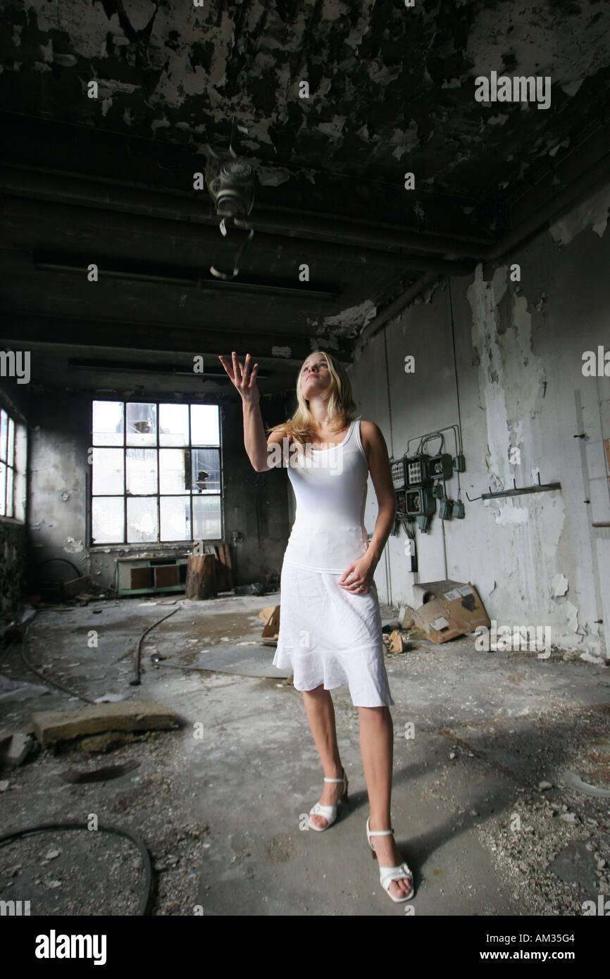 girl throw face mas inside old building Stock Photo - Alamy