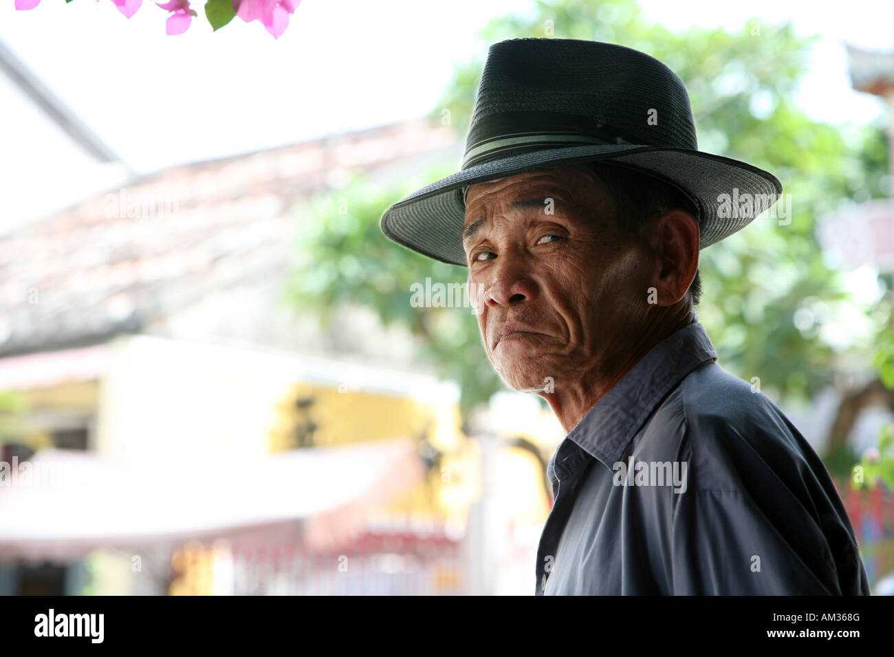 Old man Hoi An Vietnam Stock Photo - Alamy