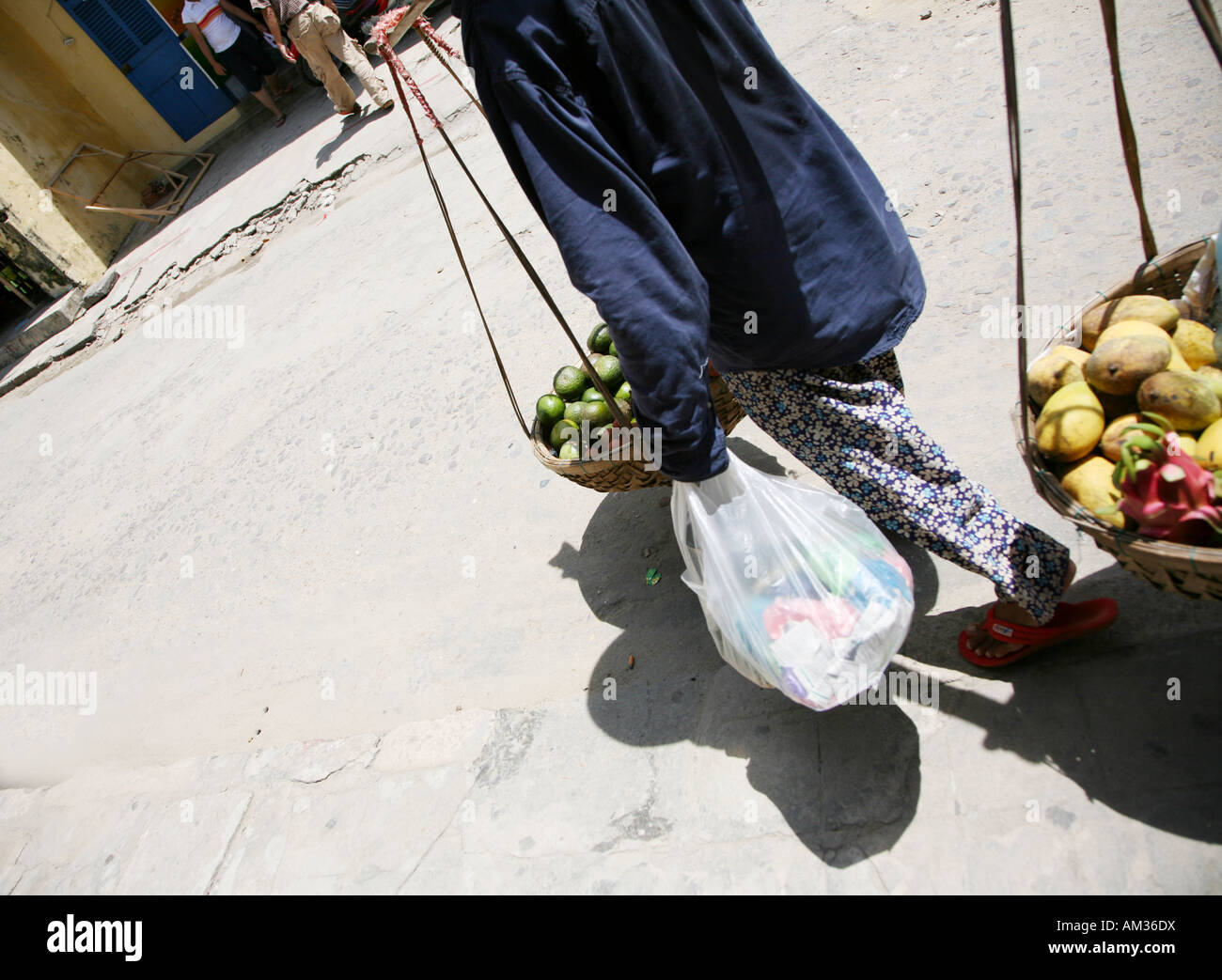 Woman Carrying food Hoi An Vietnam Stock Photo - Alamy