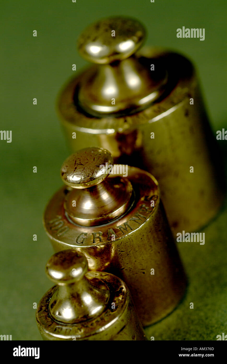 Three French copper scale weights in a row Stock Photo - Alamy