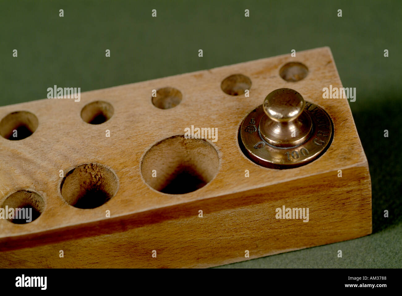 Copper scale weight in a wooden box Stock Photo - Alamy