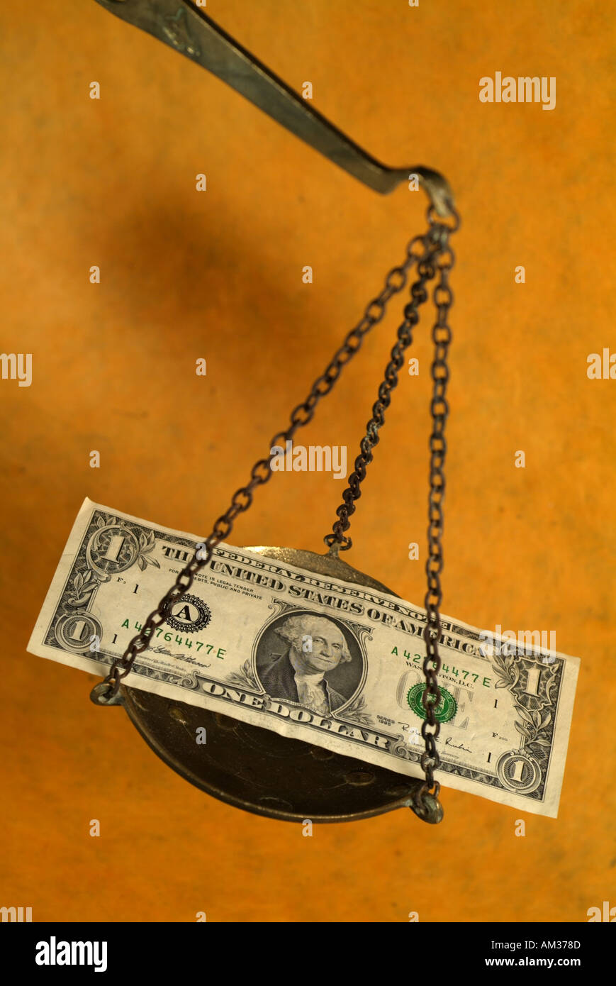 Scale weighing one US dollar banknote Stock Photo - Alamy