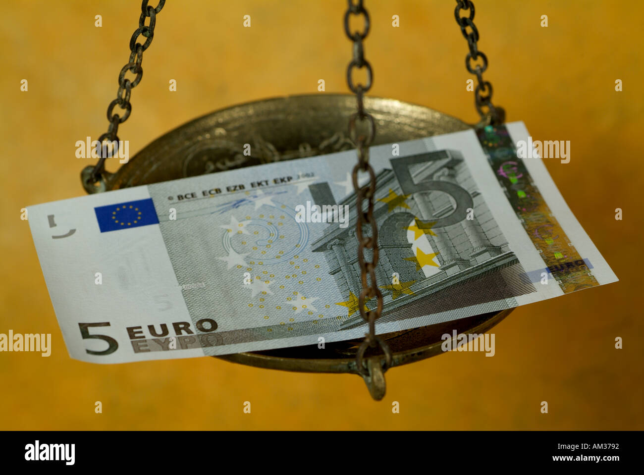 Euro of bank notes and dollar on scales hi-res stock photography and ...