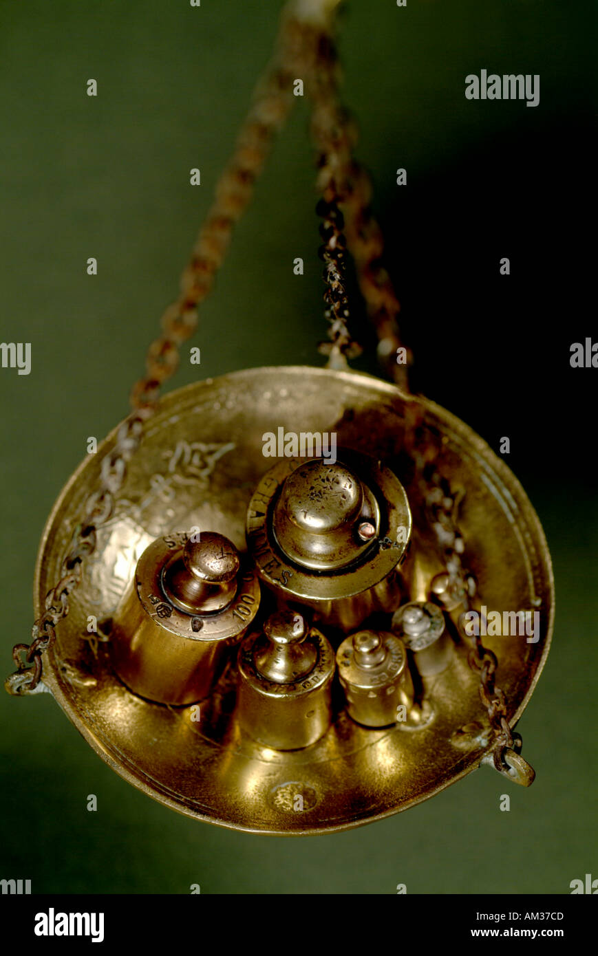 Group of French copper weights hanging on a scale Stock Photo - Alamy
