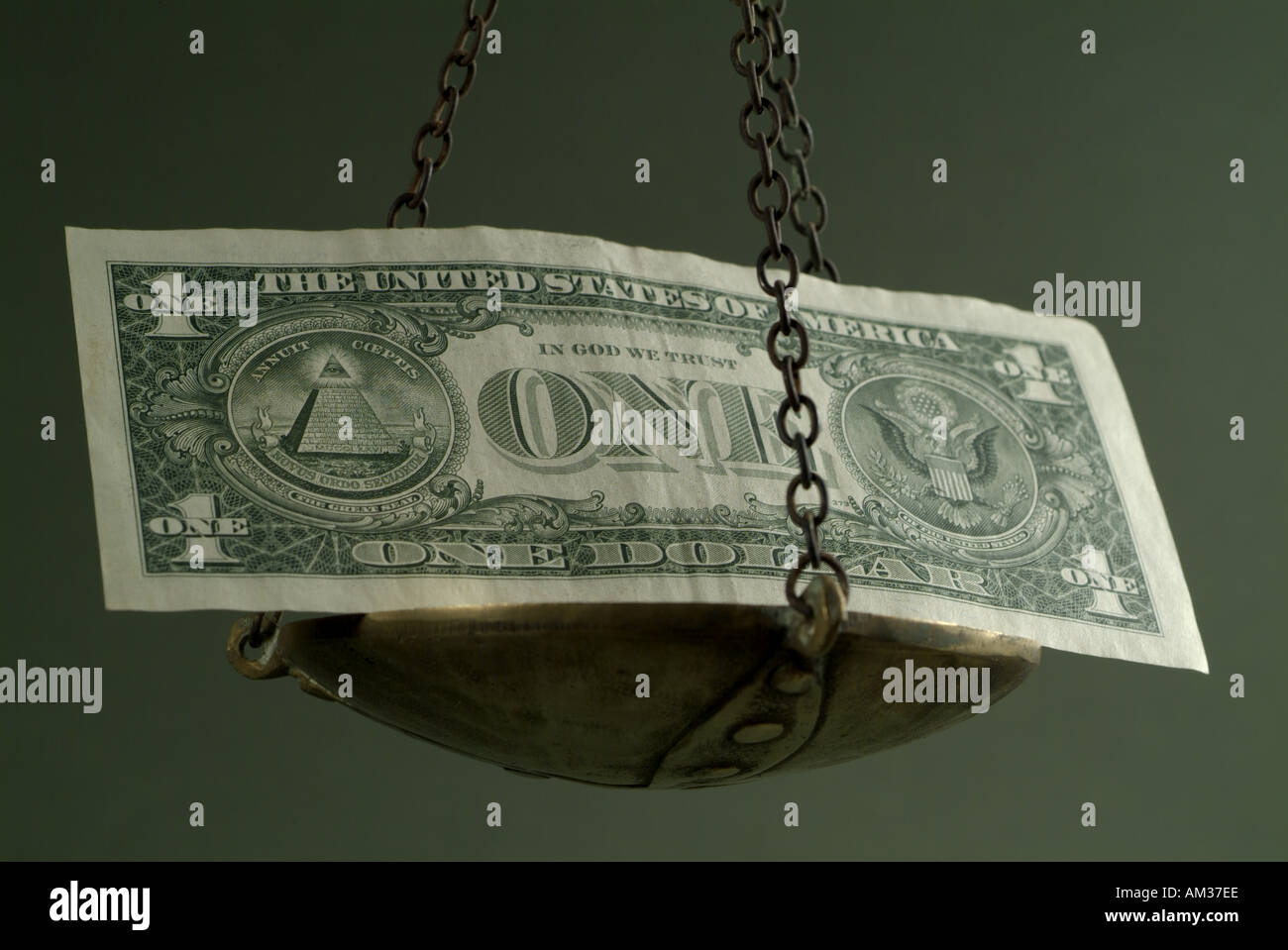 Scale weighing a us one dollar banknote Stock Photo - Alamy