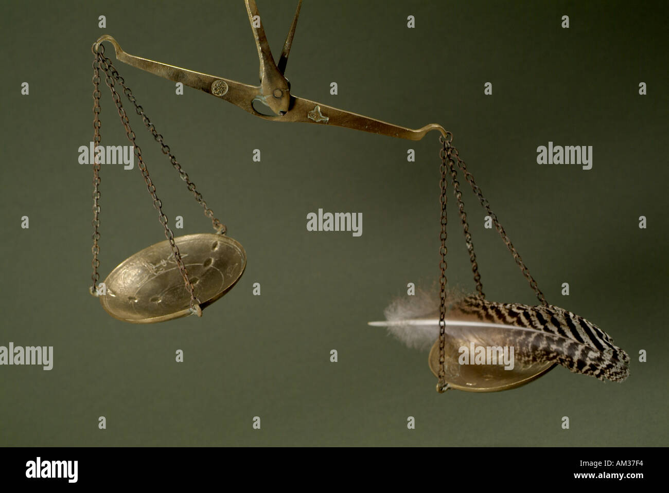 Balance scale feather hi-res stock photography and images - Alamy
