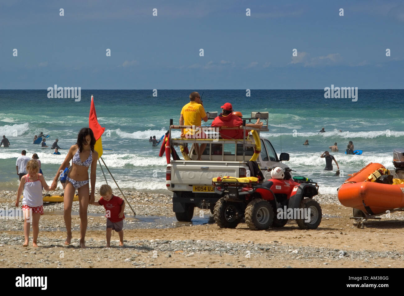 lifeguards sitting in a vehicle at the shoreline,porthtowan,cornwall ...