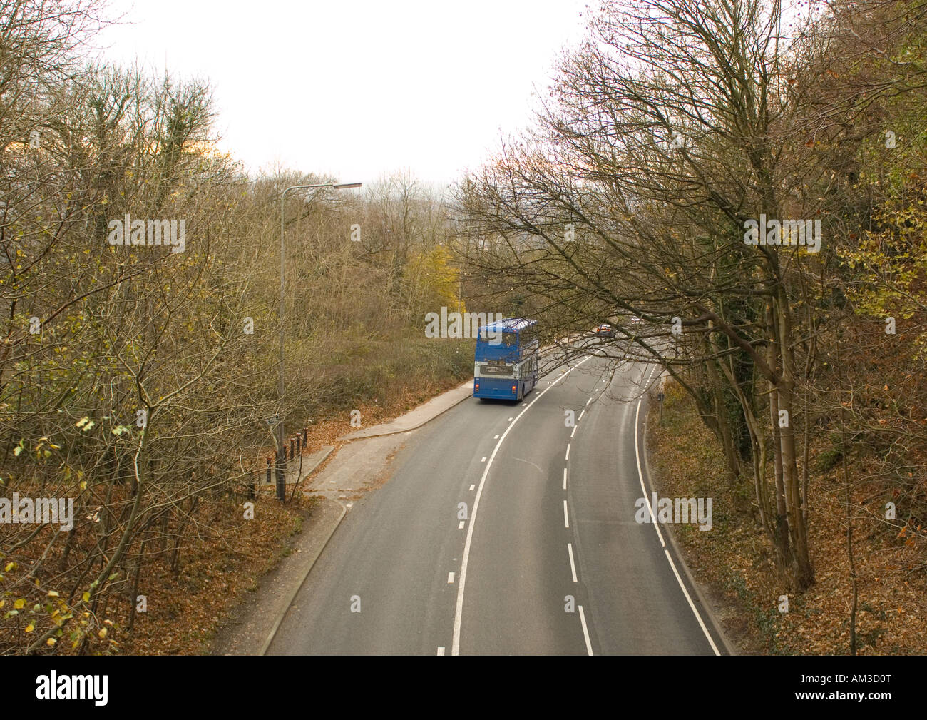 Blue double-decker bus on A217, arterial road, Reigate Hill, Surrey ...