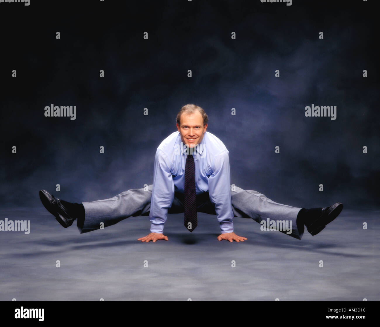 business man standing on his hands with legs spread Stock Photo - Alamy