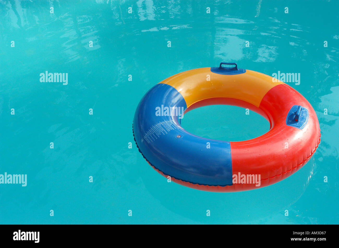 Rubber ring floating in a swimming pool Stock Photo - Alamy