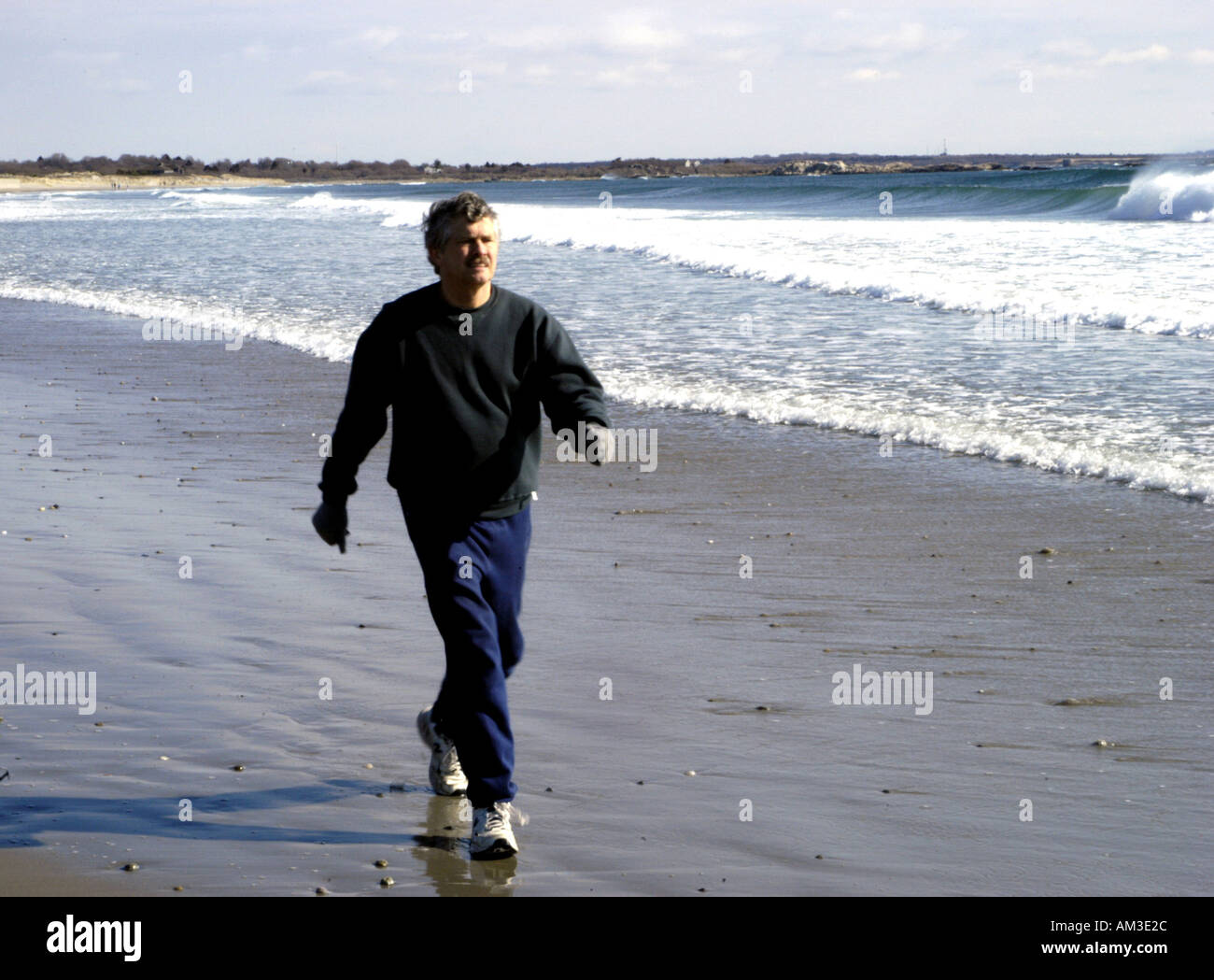 Man walking on beach in hi-res stock photography and images - Alamy