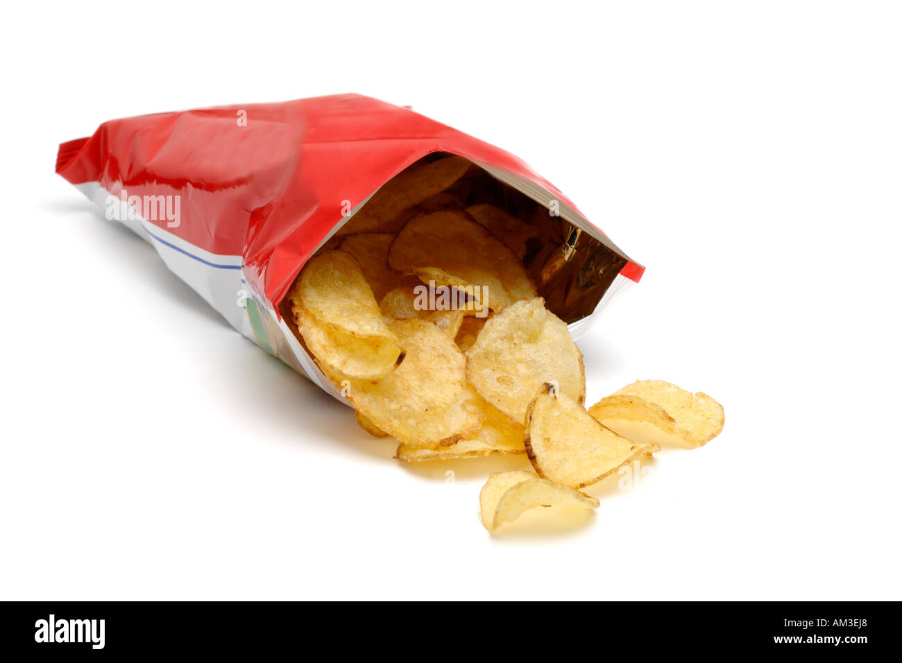 Potato crisps spilling from packet Stock Photo - Alamy
