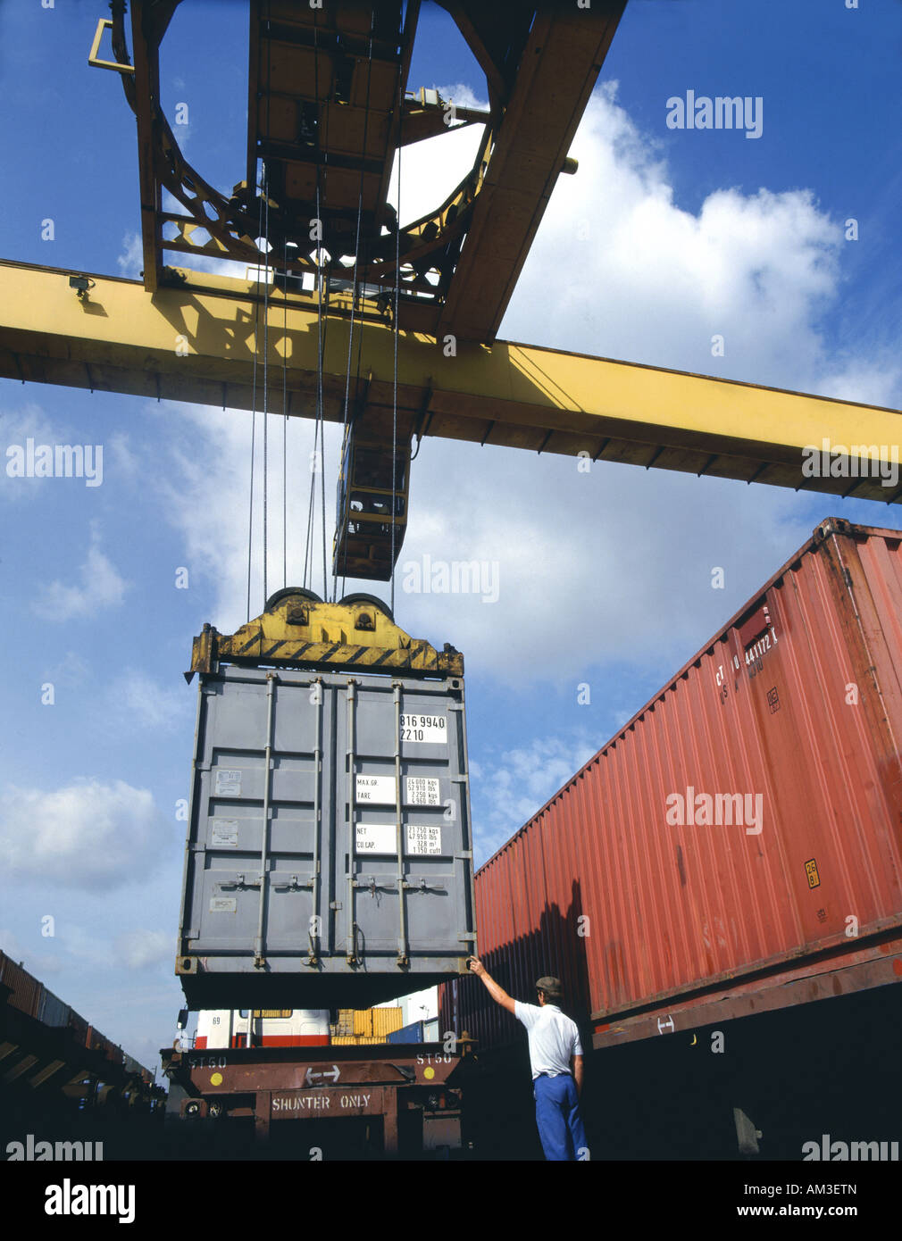 Shipping container being loaded onto specialised lorry Stock Photo - Alamy