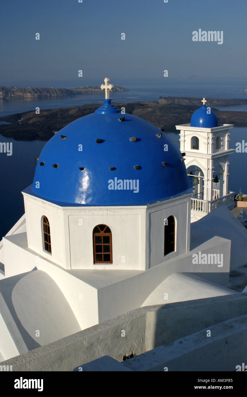 Traditional blue domed Greek orthodox church roof overlooking the Agean ...
