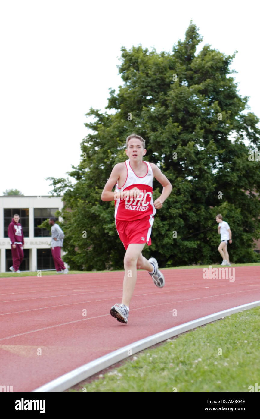 Teenage boy runner at a high school track and field district meet Stock ...