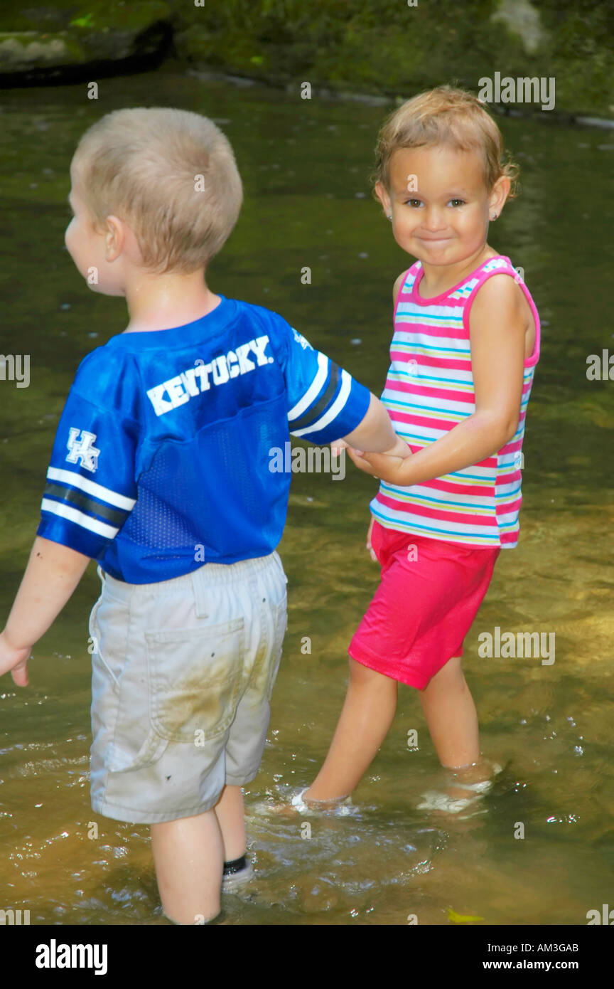 Boy girl wading in water hi-res stock photography and images - Alamy