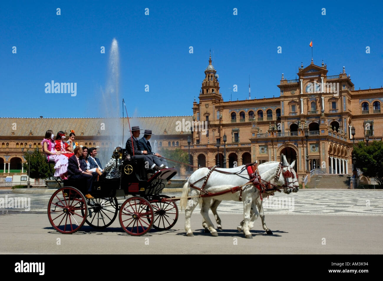 Horsedrawn cart driving people around the Plaza de Espana during the ...