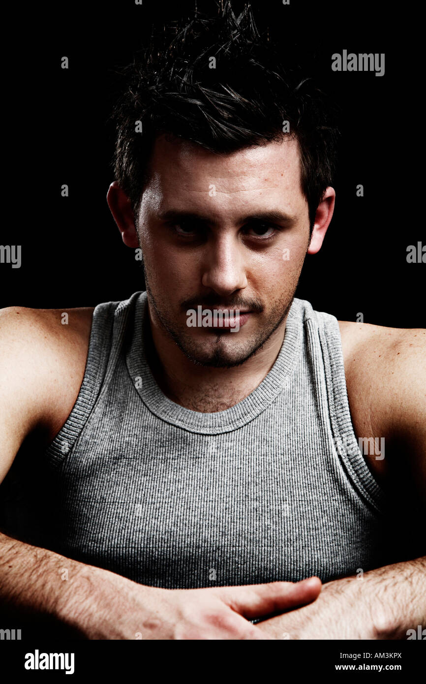 Young man looking intensely at the camera Stock Photo - Alamy