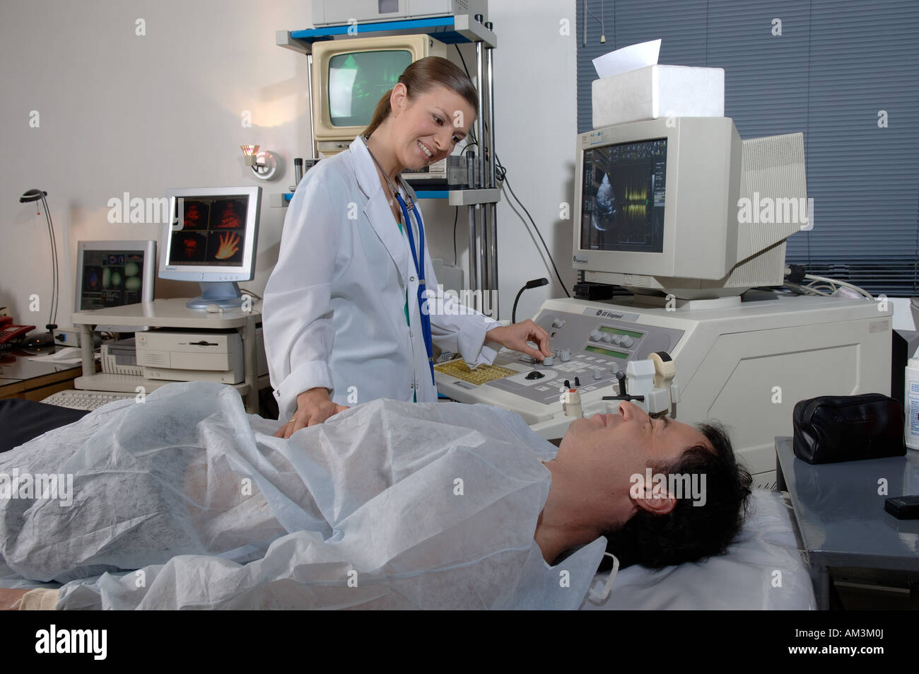 Doctor with ultrasound scan on a male patient Stock Photo - Alamy