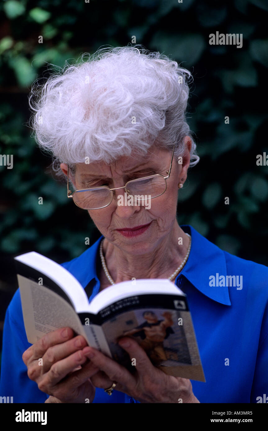 Senior reading a book Stock Photo - Alamy