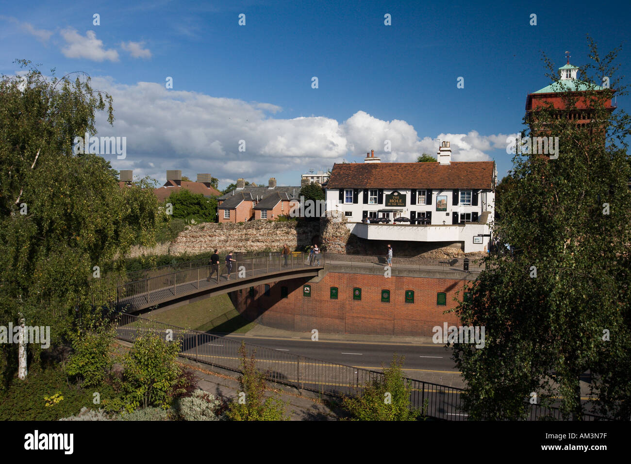 The Hole in the Wall pub near Balkerne Gate Roman wall with Jumbo water ...