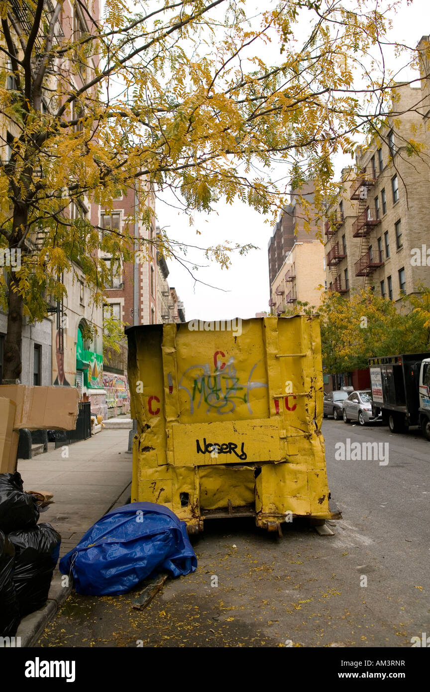 Yellow dumpster standing in a street in New York City USA Stock Photo ...