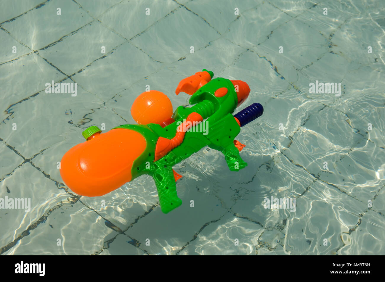 water pistol in a pool Stock Photo - Alamy