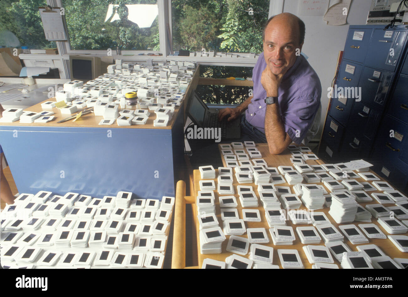 Photographer Joe Sohm editing thousands of slides in Woodstock New York ...