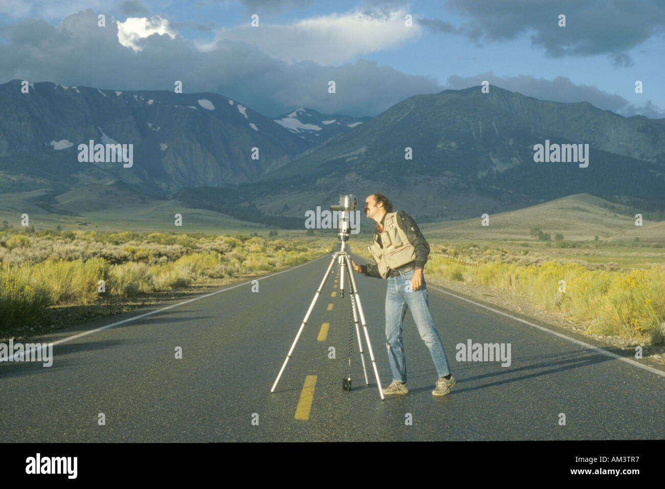 Photographer Joe Sohm posing with panoramic camera on Route 108 facing ...