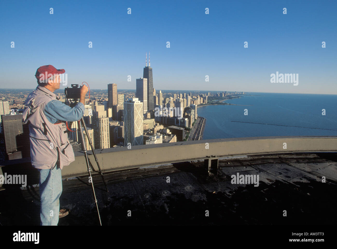 Photographer Joe Sohm posing with camera while shooting the Chicago ...