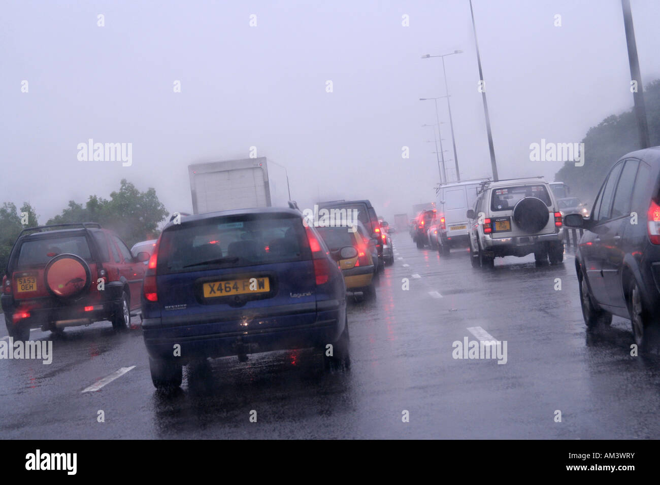 Traffic stuck on motorway during heavy rain in July 2007 UK Stock Photo ...