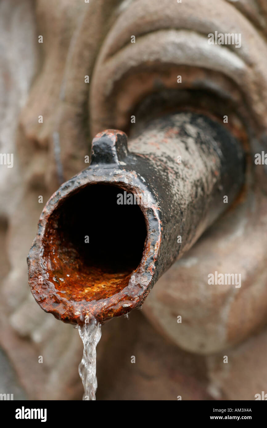 Rusted public fountain water pipe Stock Photo - Alamy