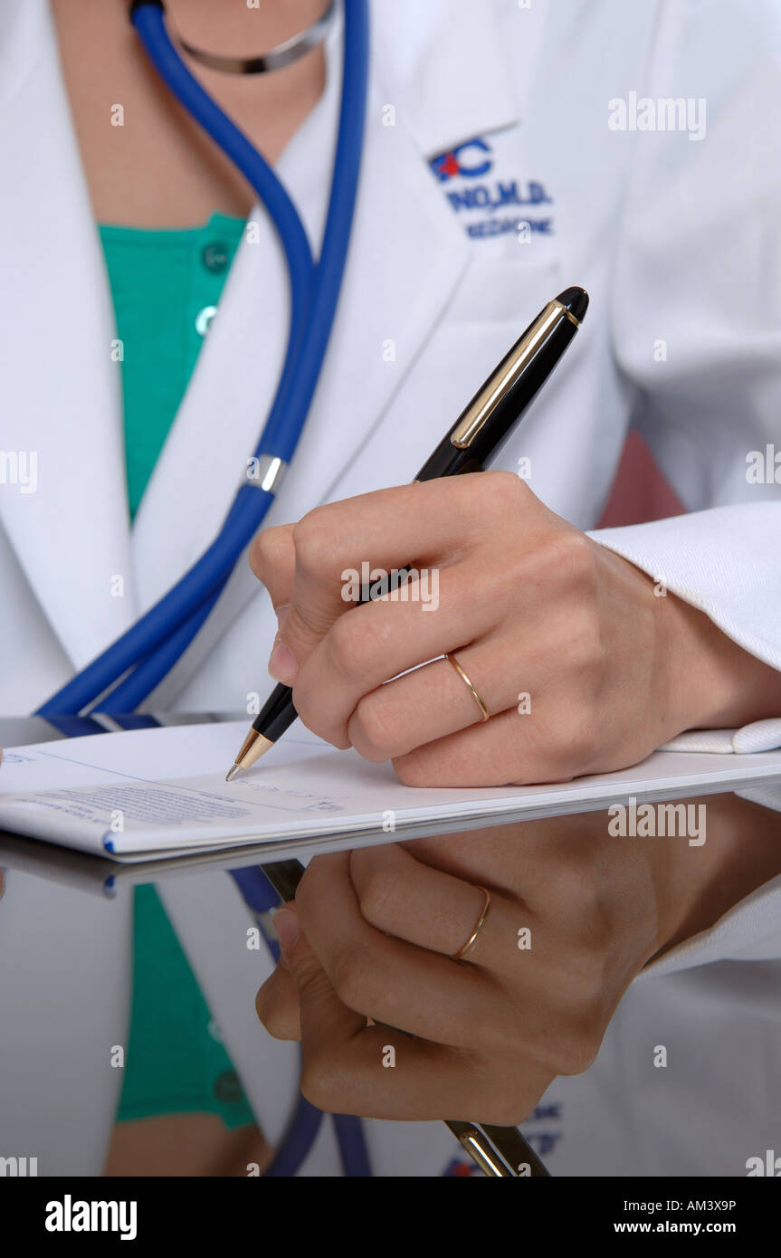 Hand of a doctor writing a prescription Stock Photo - Alamy
