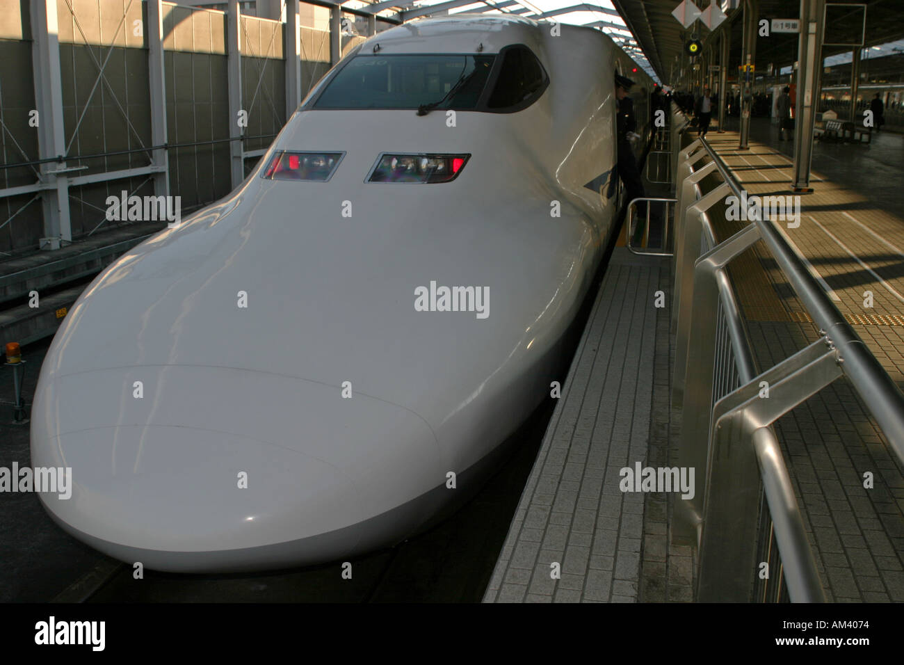 Modern technology Hikari Shinkansen bullet train waiting at Shin Osaka ...