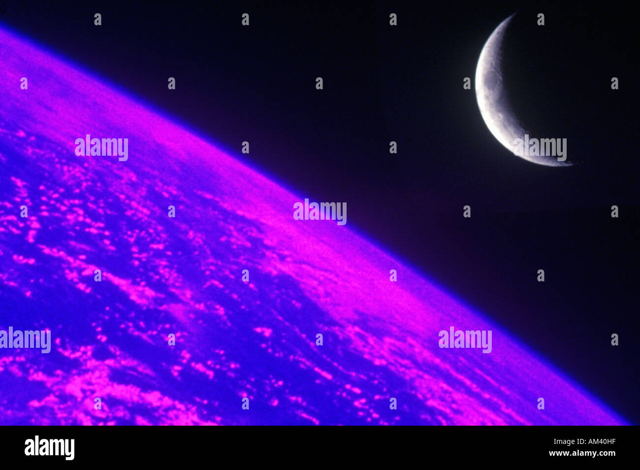 The edge of Earth viewed from space with a crescent moon against a ...