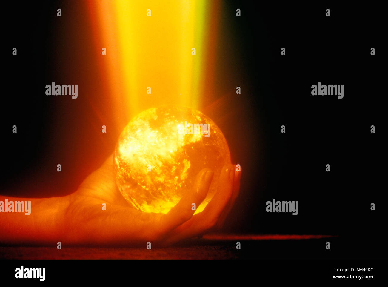 Hands holding earth globe orange hi-res stock photography and images ...