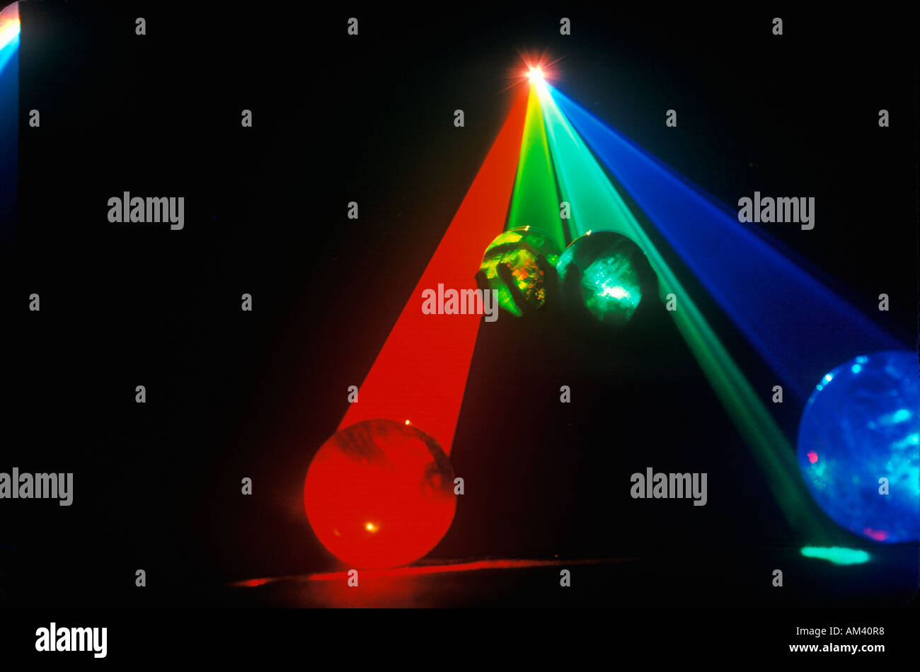 Several multi colored spheres appearing as planets with laser lights ...