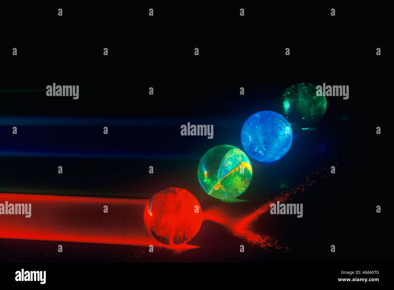 Several multi colored spheres appearing as planets with laser lights ...