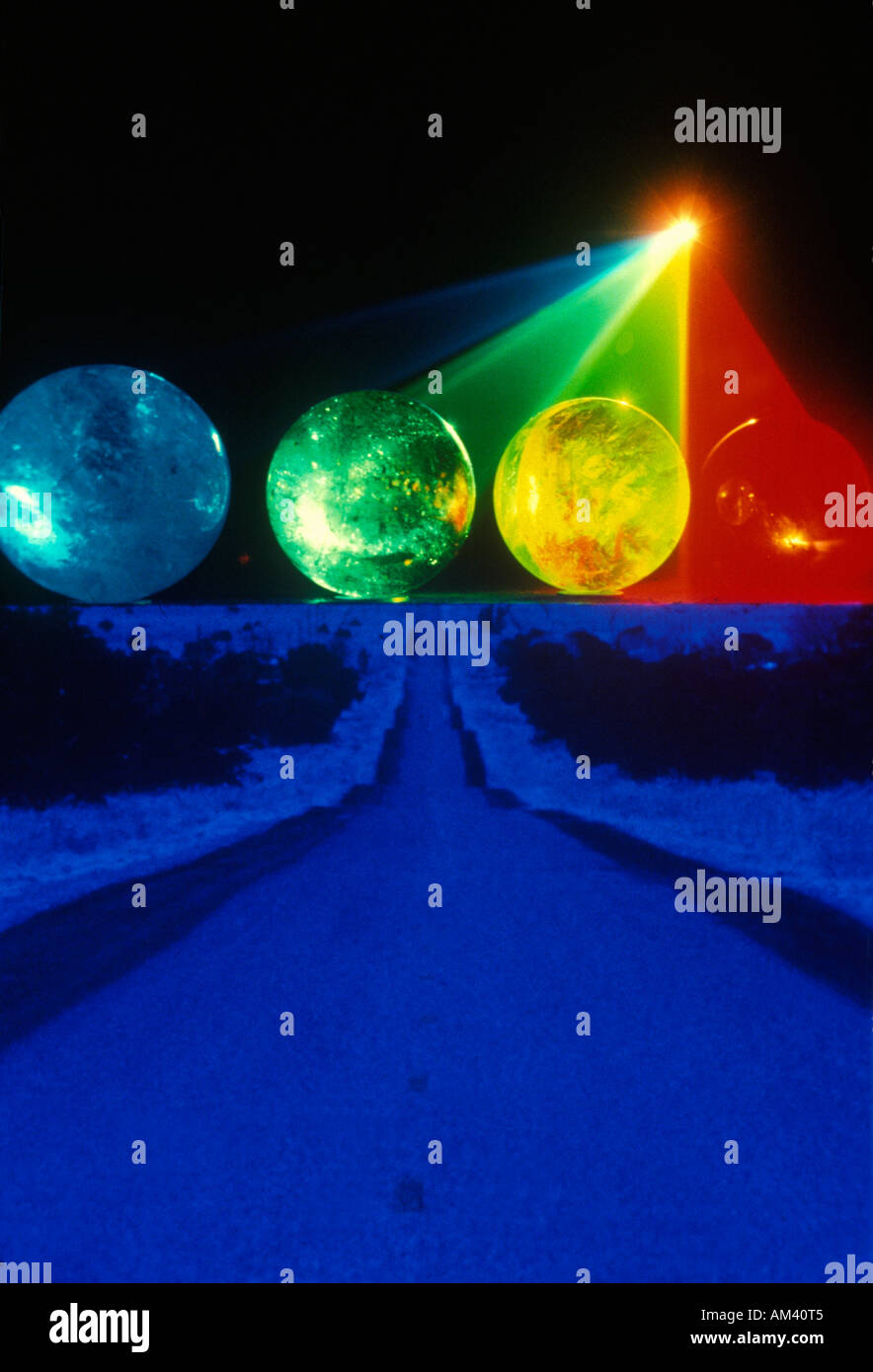 A blue and black horizon below several multi colored spheres appearing ...