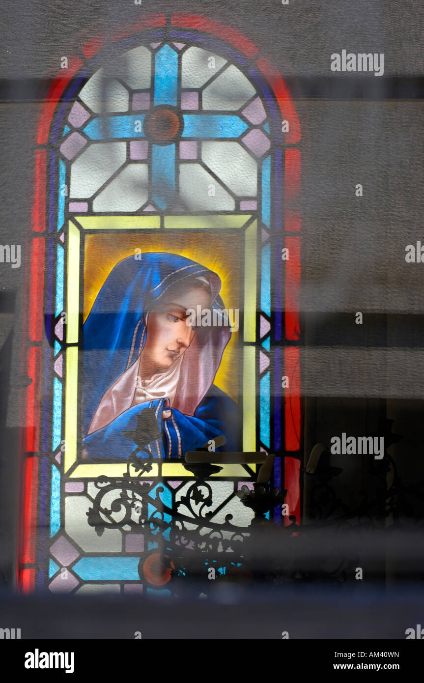 A glimpse of a stained-glass window inside a tomb in Recoleta Cemetery ...