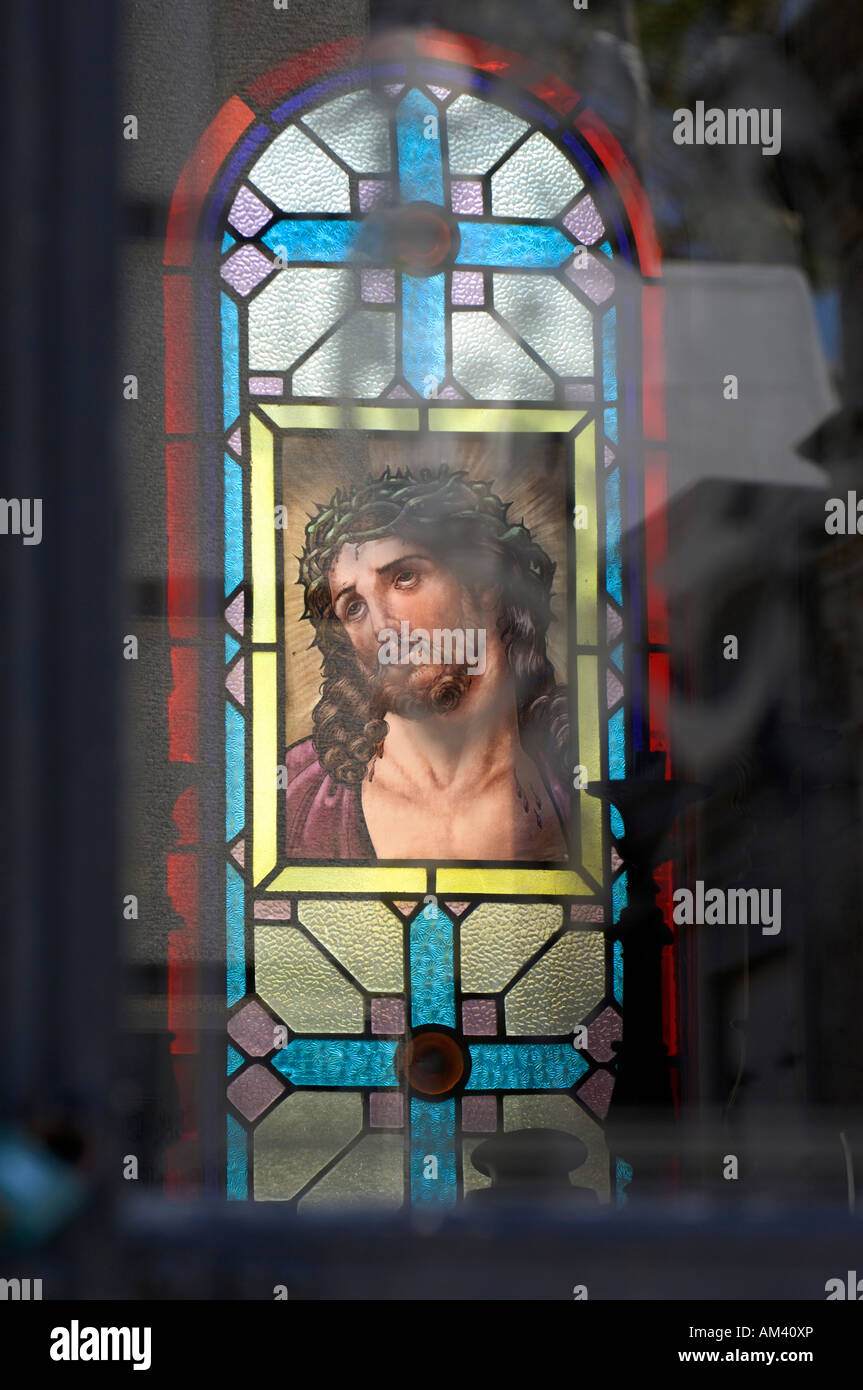 A glimpse of a stained-glass window in a tomb in Recoleta Cemetery ...